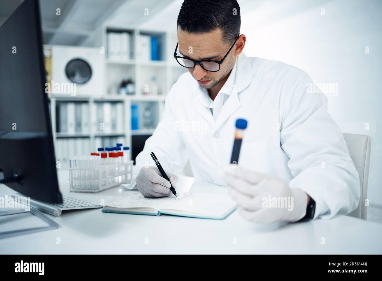Man, scientist and writing with blood sample for research, cure or ...