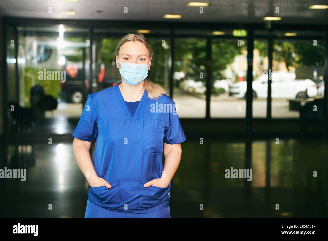 Nurse wearing blue uniform hi-res stock photography and images - Alamy