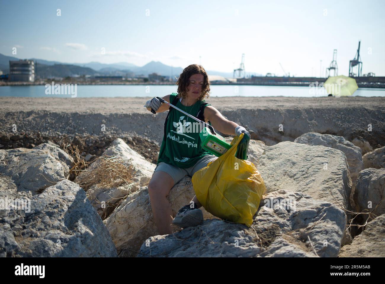 Malaga, Spain. 04th June, 2023. A volunteer is seen collecting waste ...