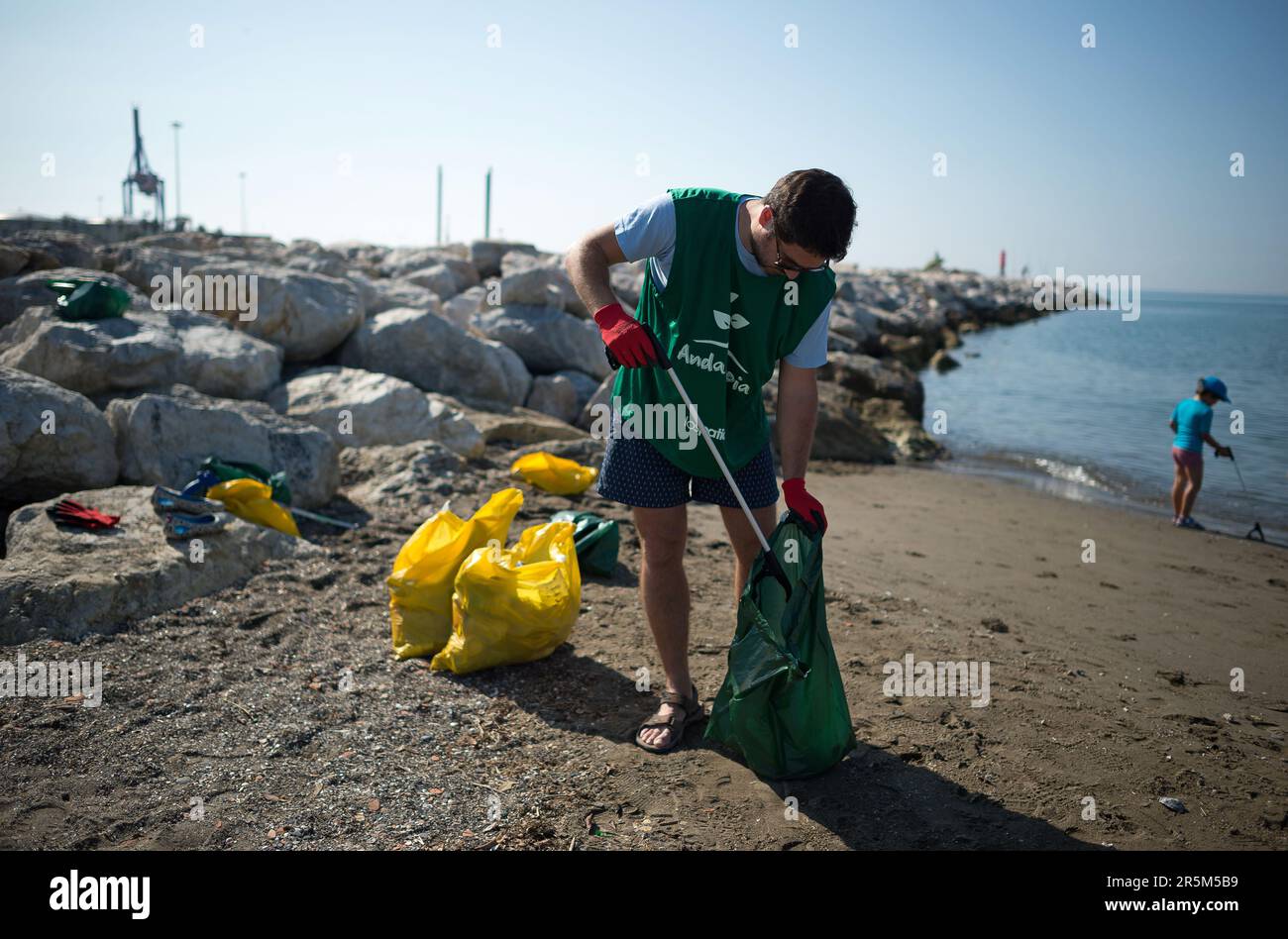 Malaga, Spain. 04th June, 2023. A volunteer is seen collecting waste ...