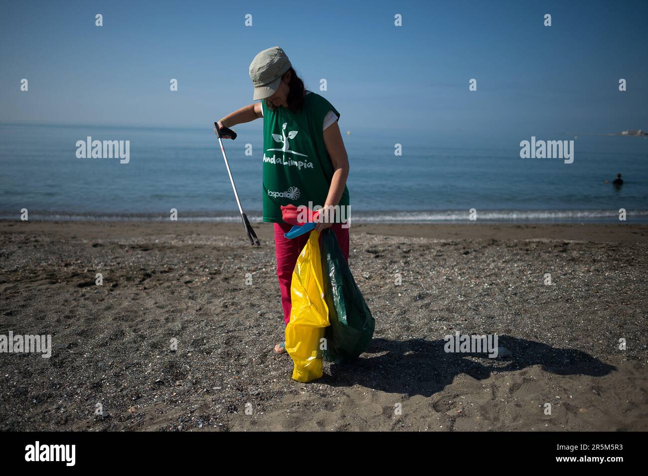 Malaga, Spain. 04th June, 2023. A volunteer is seen collecting waste ...