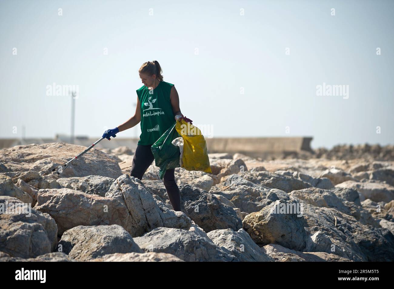 Malaga, Spain. 04th June, 2023. A volunteer is seen collecting waste ...