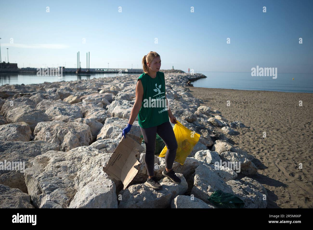 Malaga, Spain. 04th June, 2023. A volunteer is seen collecting waste ...