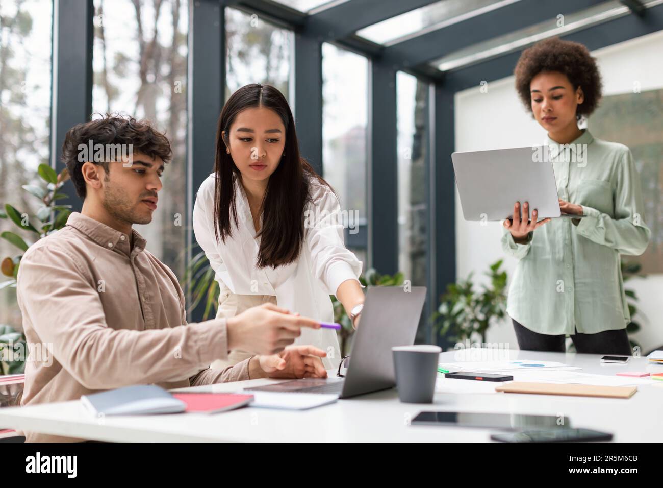 Serious office coworkers solving corporate hi-res stock photography and ...