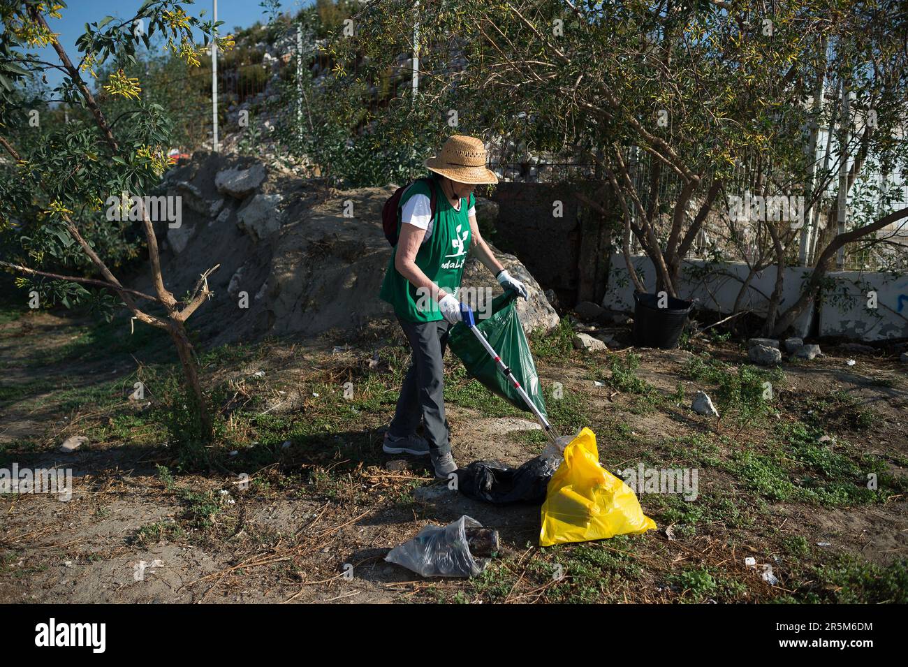 Malaga, Spain. 04th June, 2023. A volunteer is seen collecting waste ...