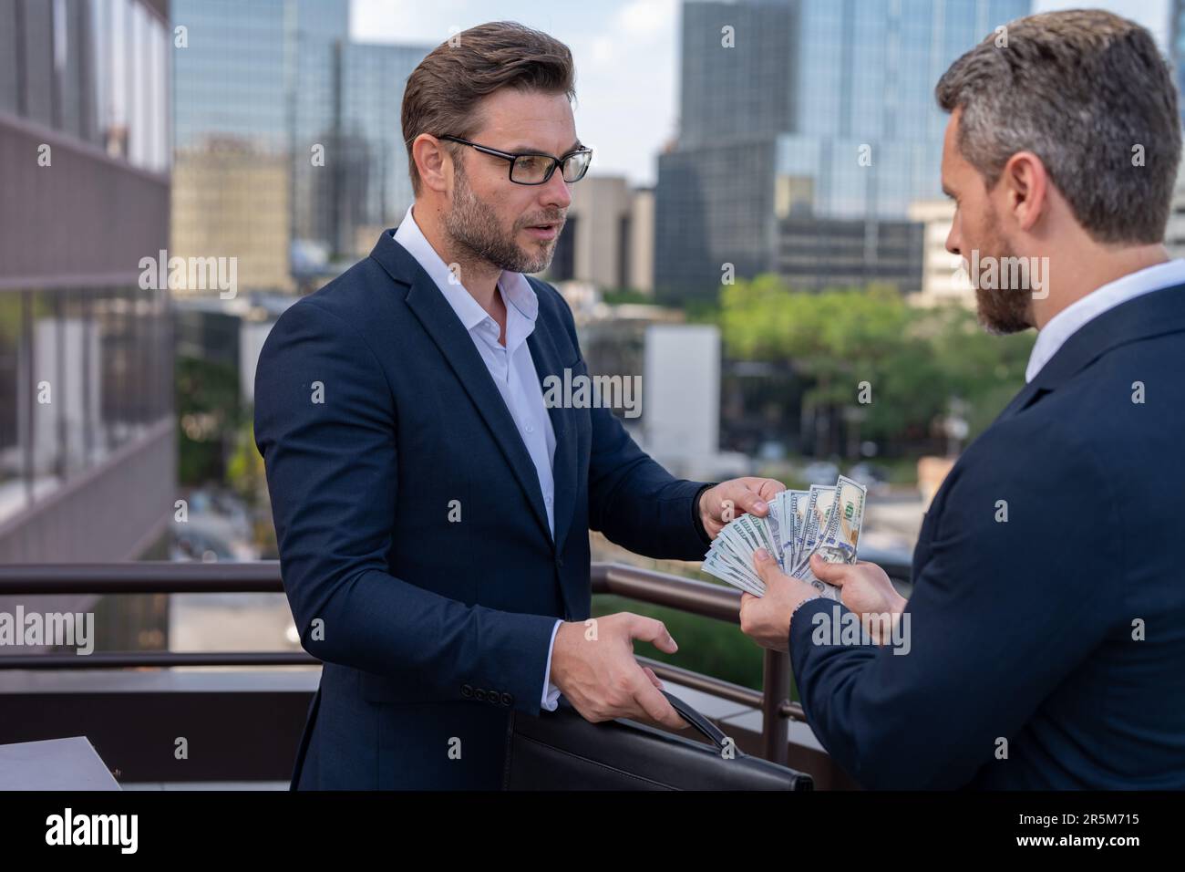 Business men giving money. Business man offering money for collage ...