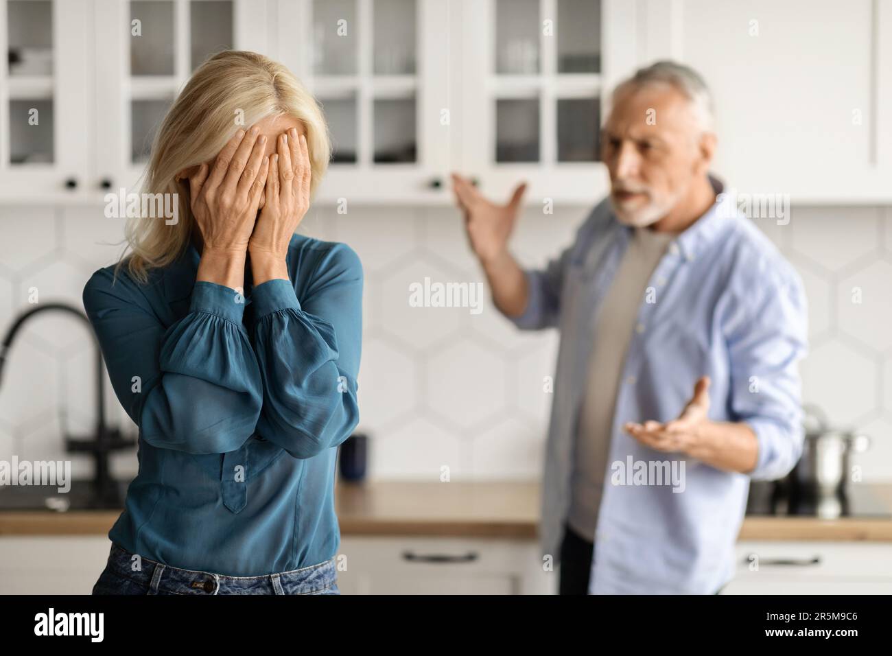 Psychological Abuse. Upset Senior Woman Crying In Kitchen While Arguing ...