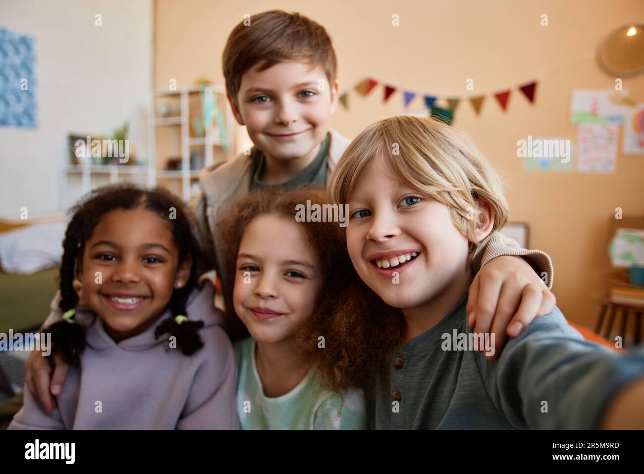 Children group play video game hi-res stock photography and images - Alamy