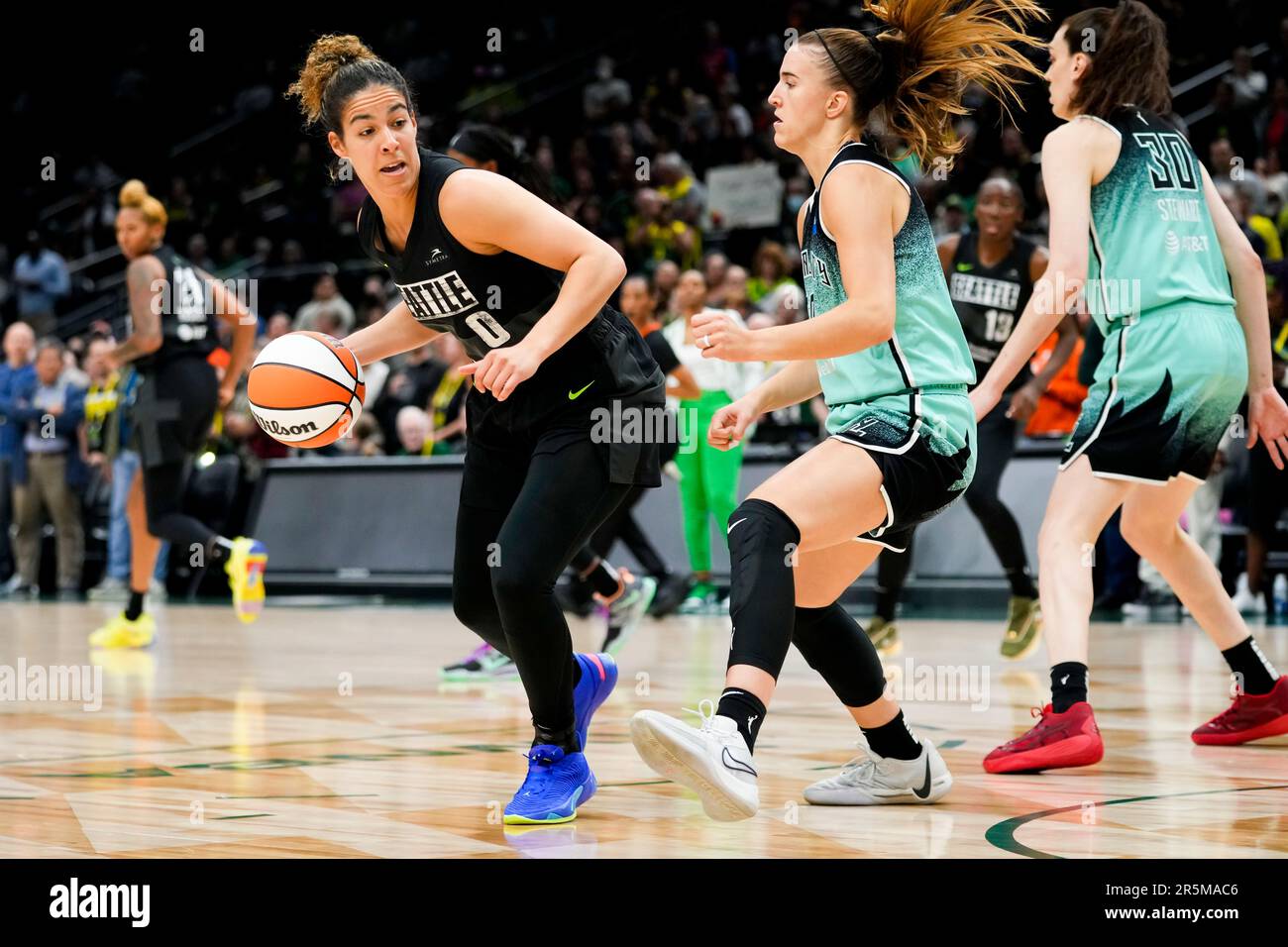 Seattle Storm guard Kia Nurse (0) looks to drive around New York ...