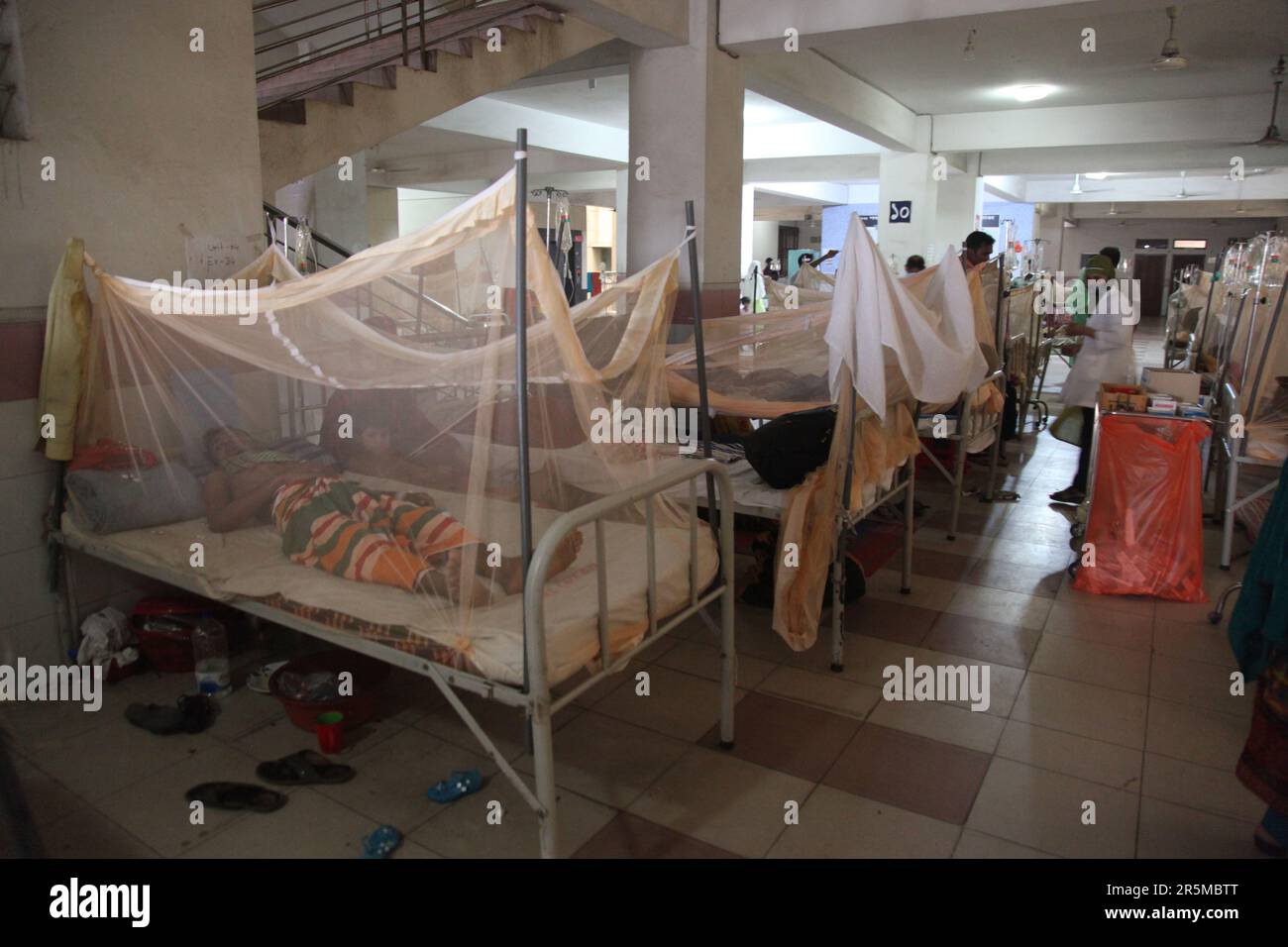 Dengue fever patients lying on the floor and on the bed outside the ...