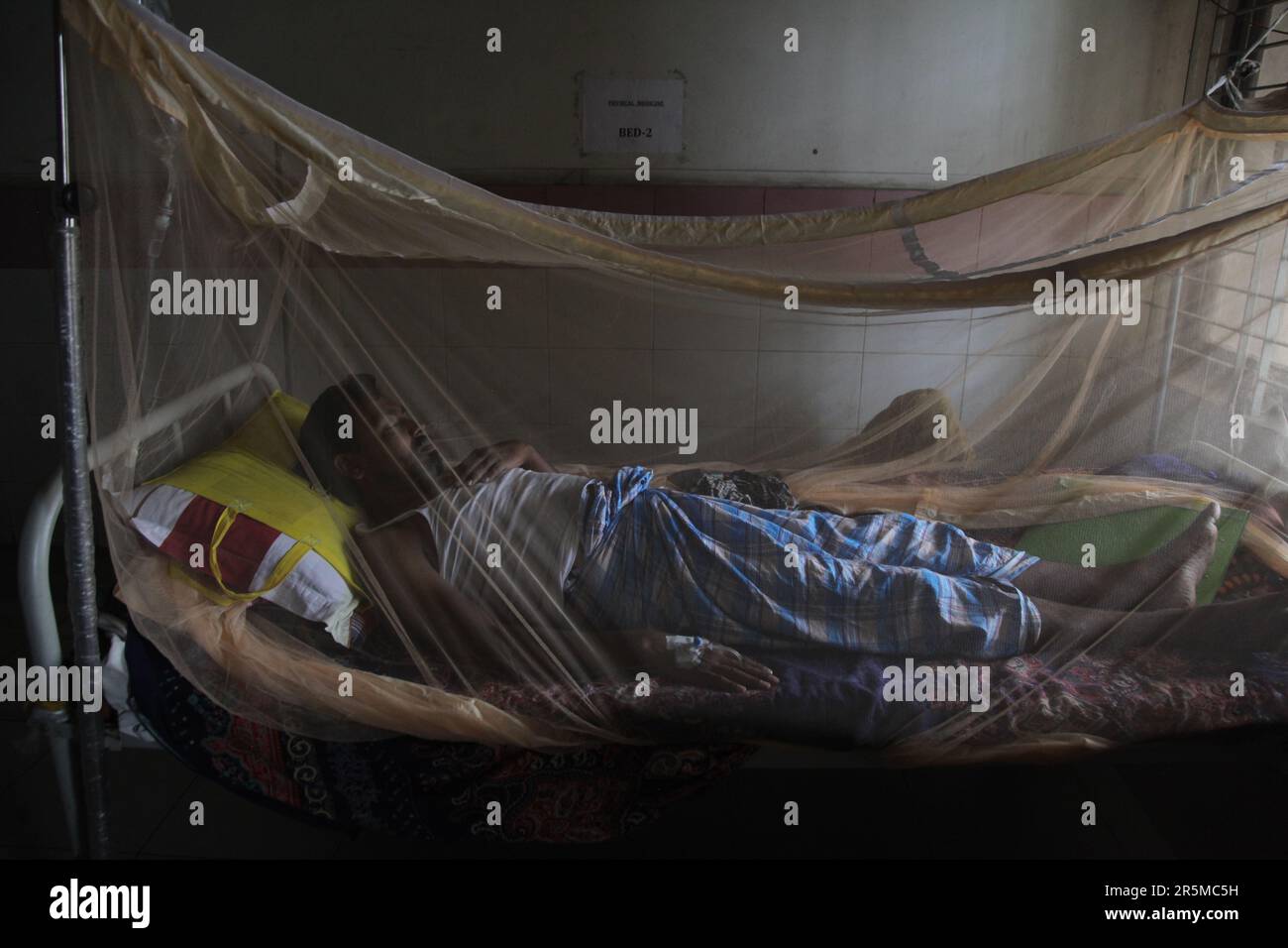 Dengue fever patients lying on the floor and on the bed outside the ...