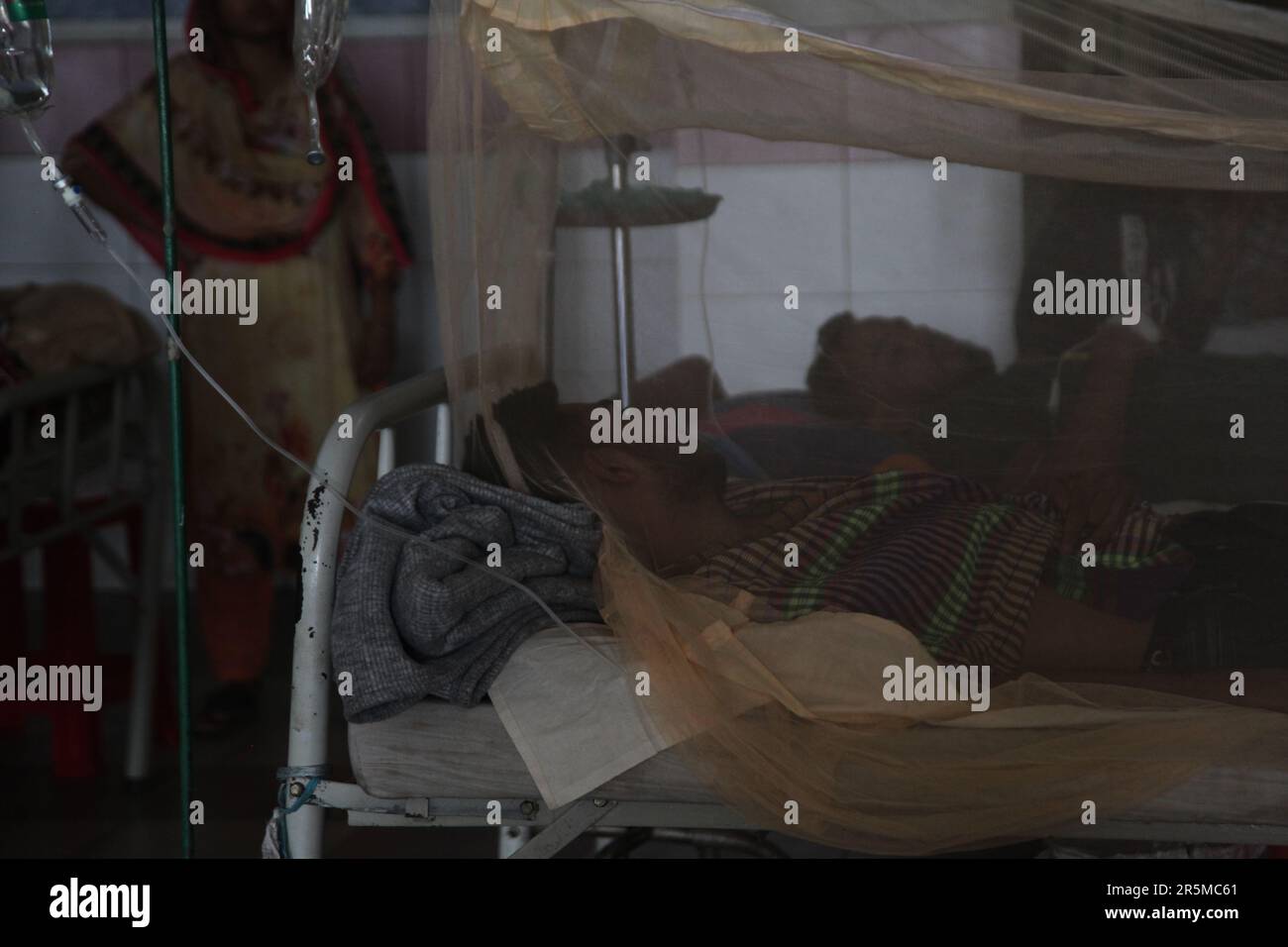 Dengue fever patients lying on the floor and on the bed outside the ...