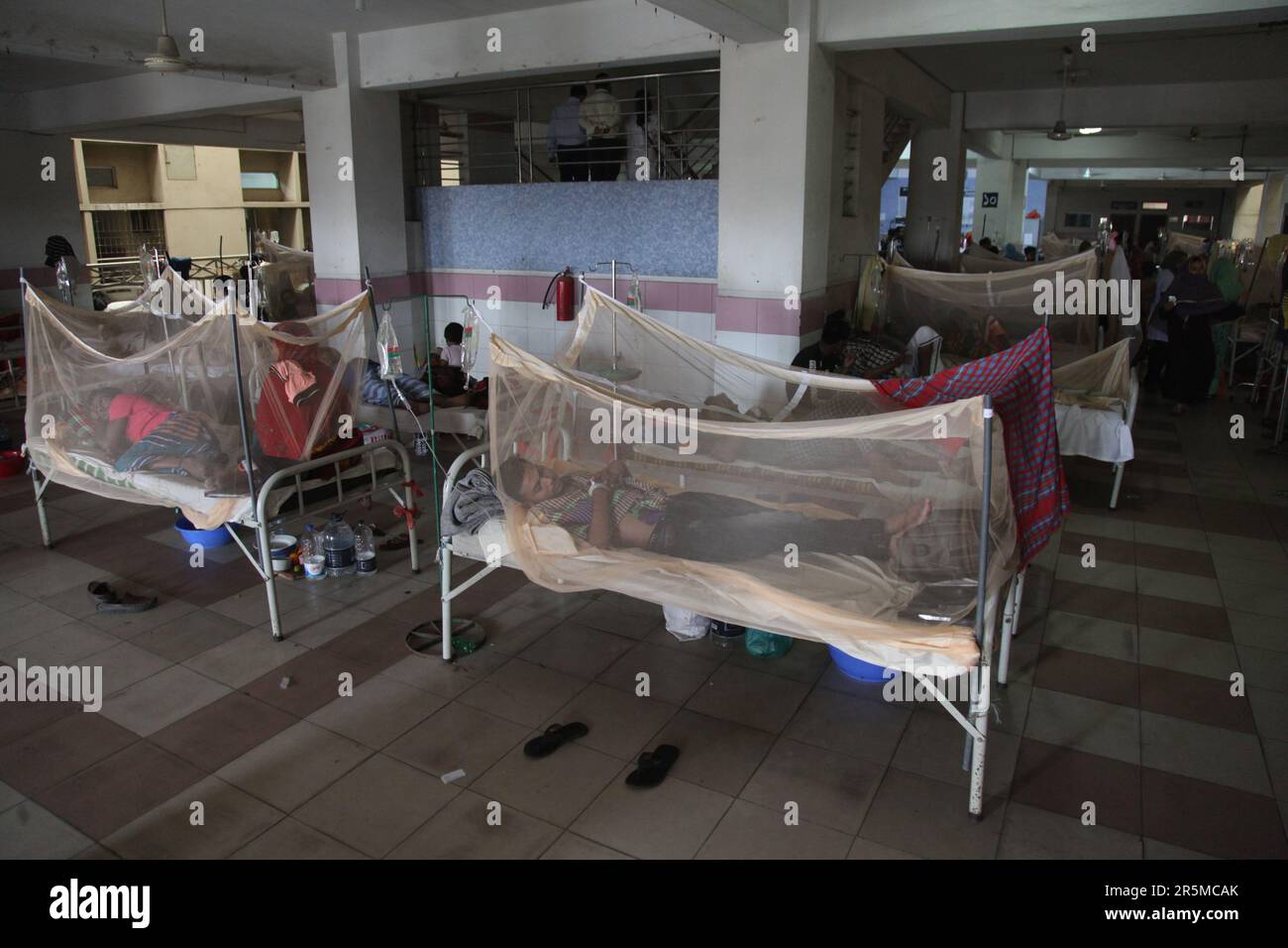Dengue fever patients lying on the floor and on the bed outside the ...