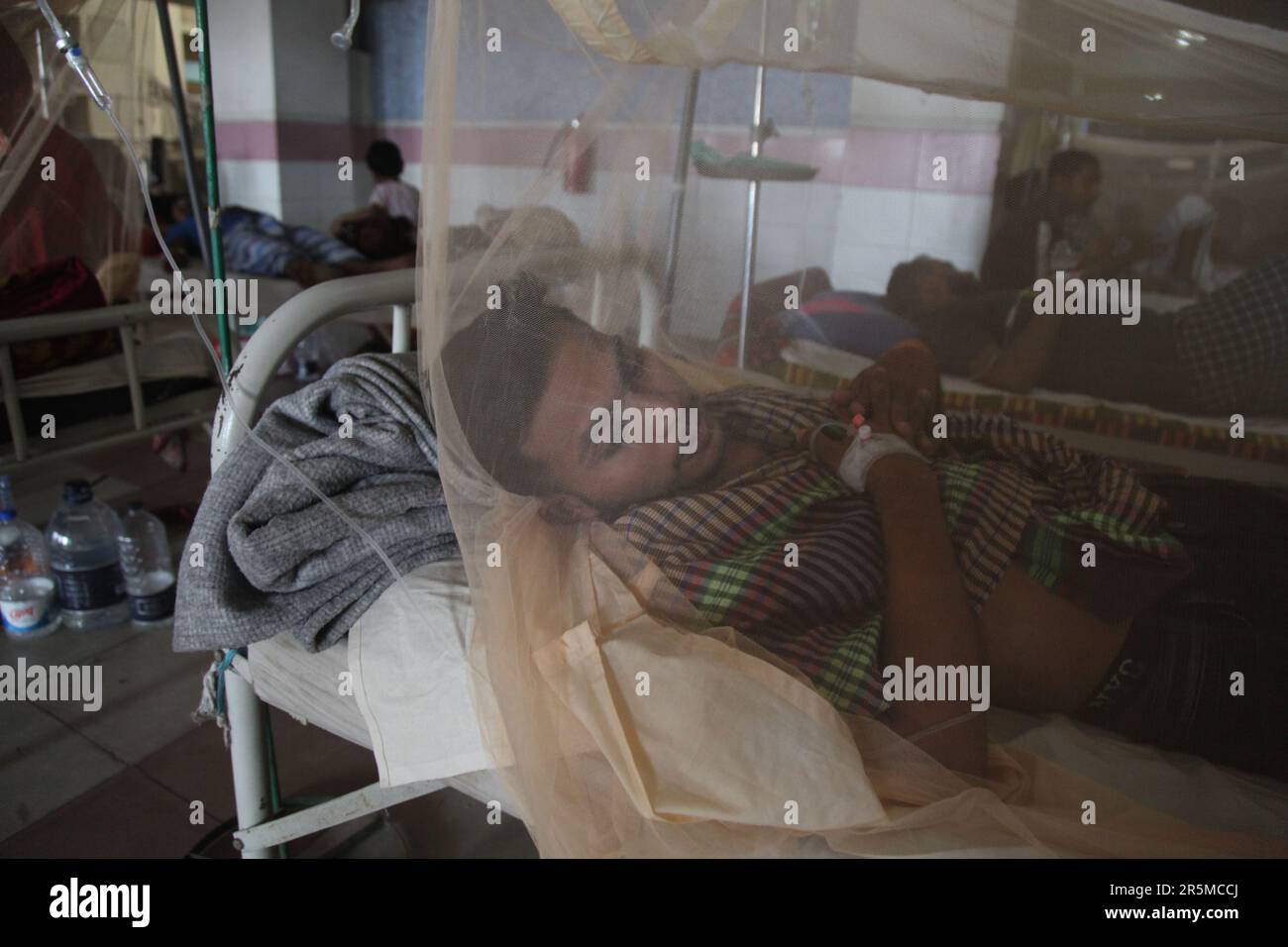 Dengue fever patients lying on the floor and on the bed outside the ...