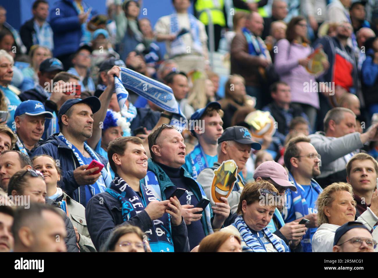 Fans of the Zenit football club are waiting for the end of the match to ...
