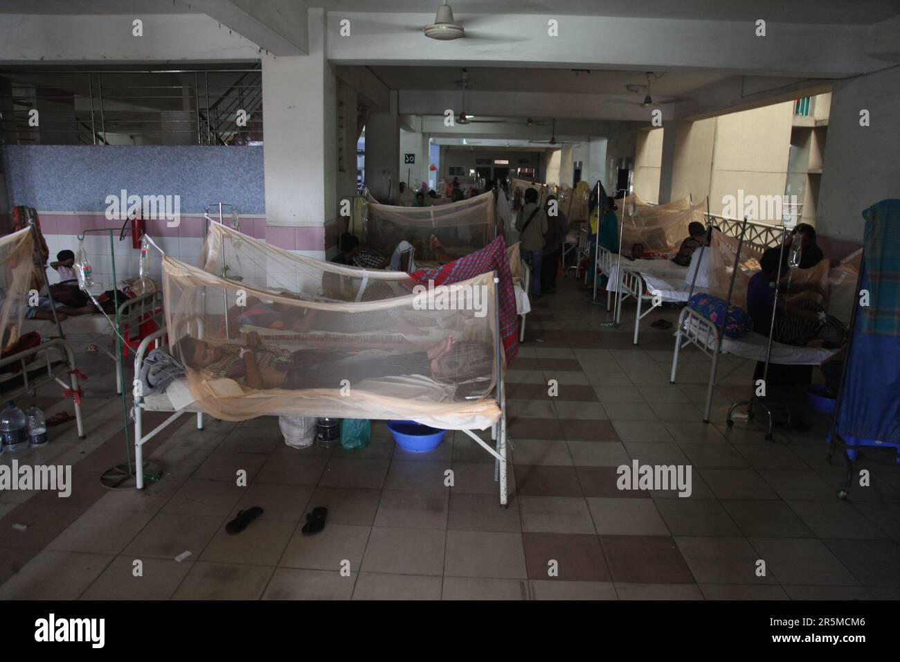 Dengue fever patients lying on the floor and on the bed outside the ...