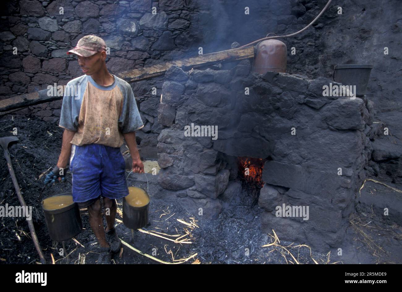 a men work at a rum distellery at a sugar cane Plantation near the town ...