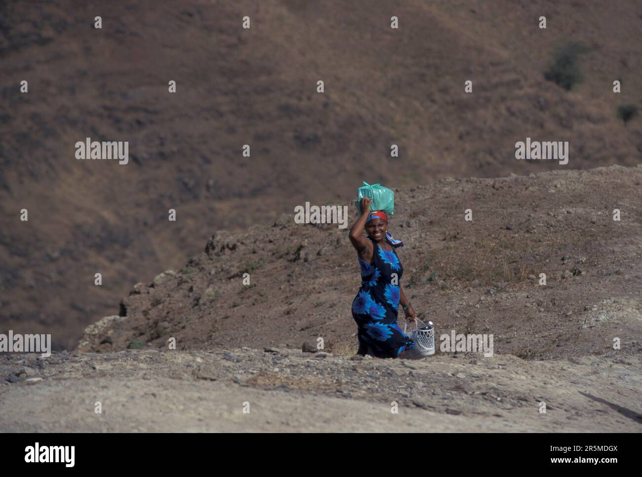 a women in the Landscape with the Volcano and Mt Fogo on the Island of ...