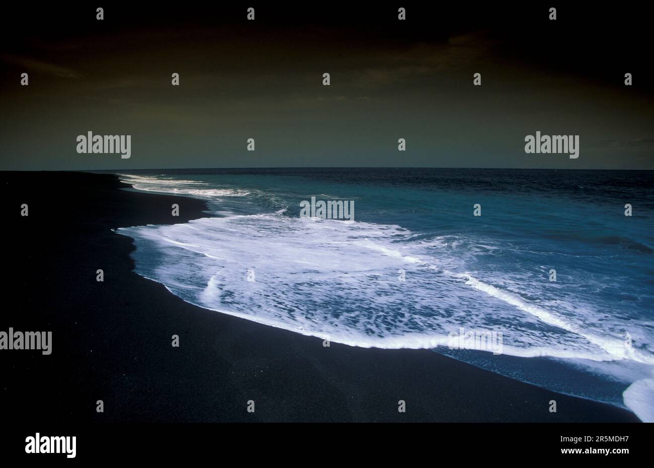 the black sand beach of volcanic lava sand at the town of Sao Filipe on ...