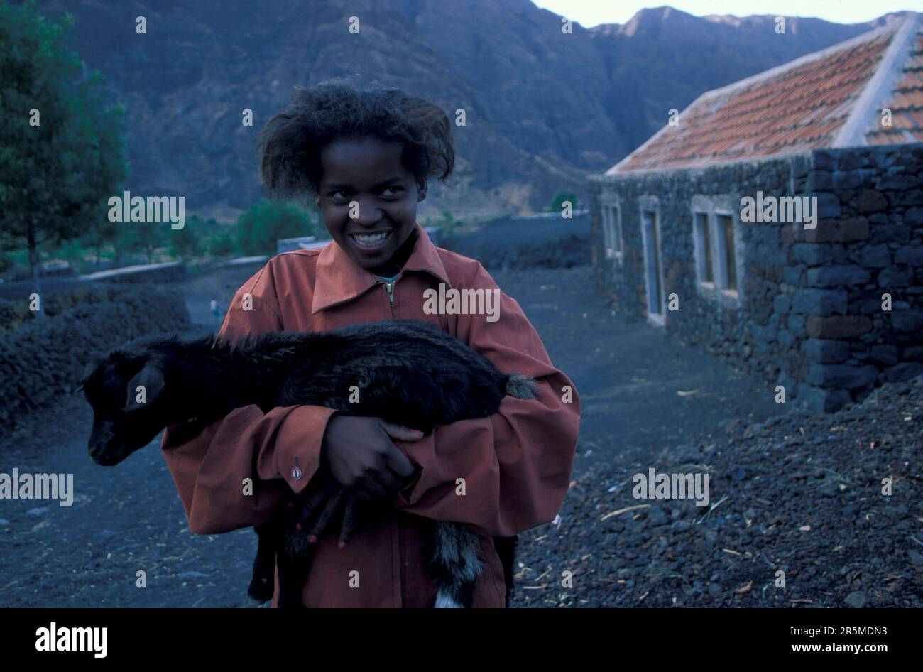 a girl with a Goat at the Cater Village in the big Crater of the ...