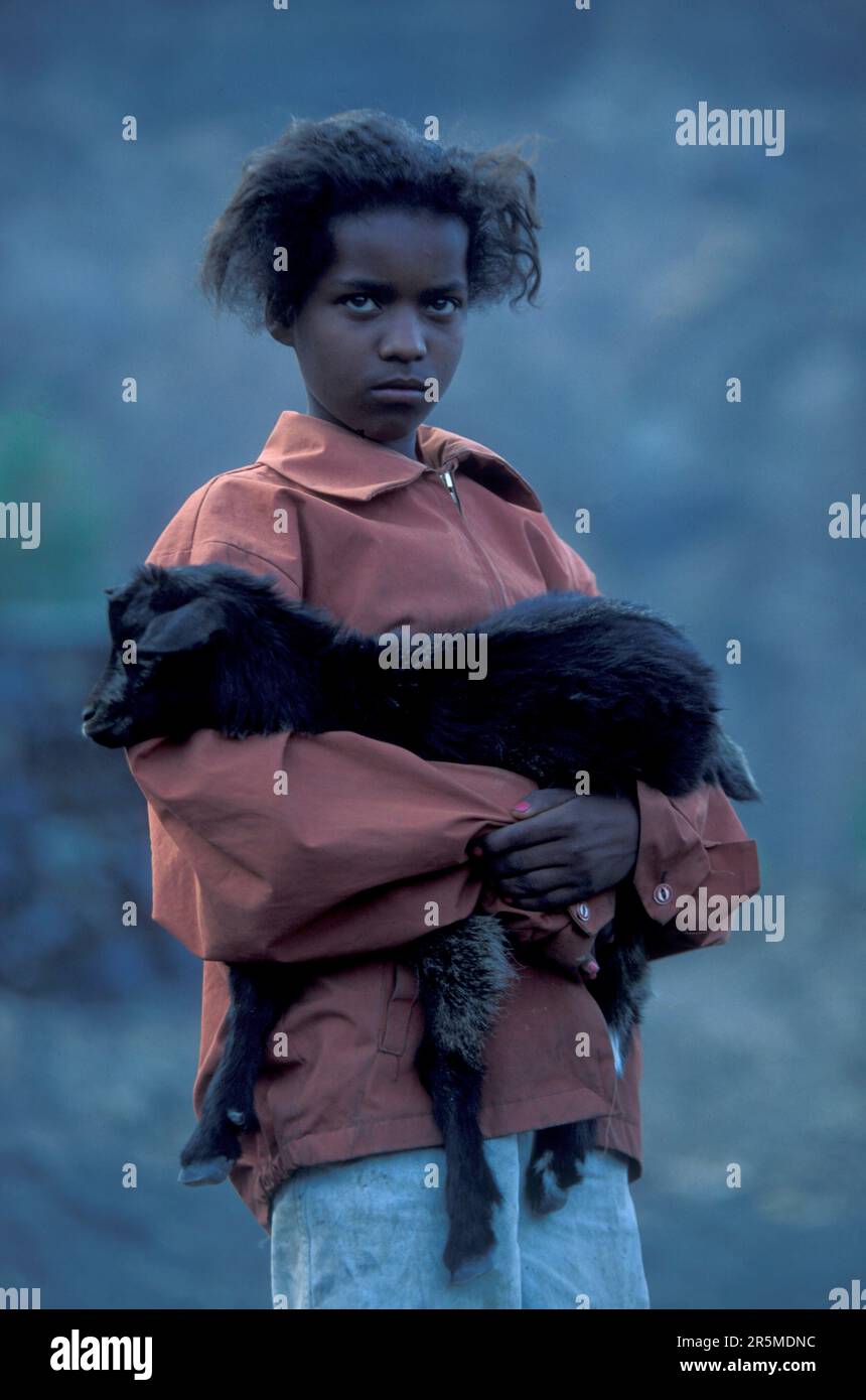 a girl with a Goat at the Cater Village in the big Crater of the ...