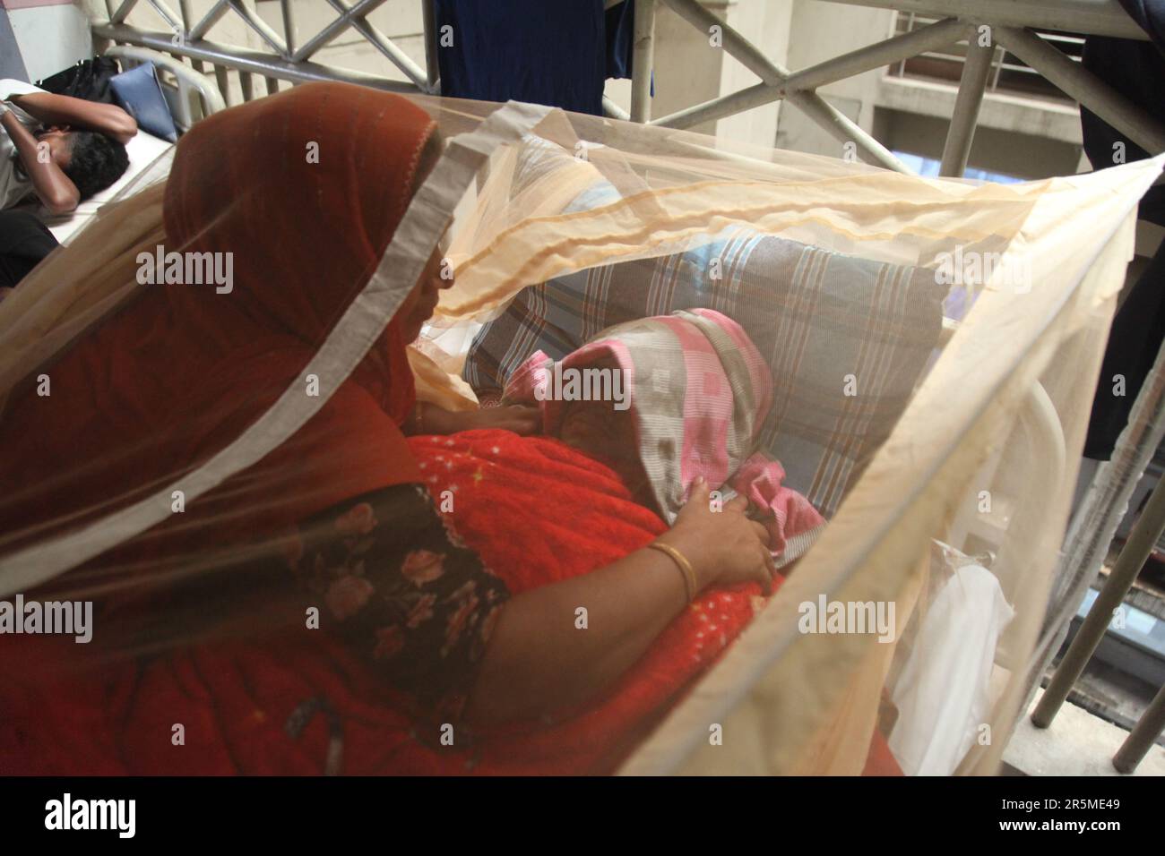 Dengue fever patients lying on the floor and on the bed outside the ...