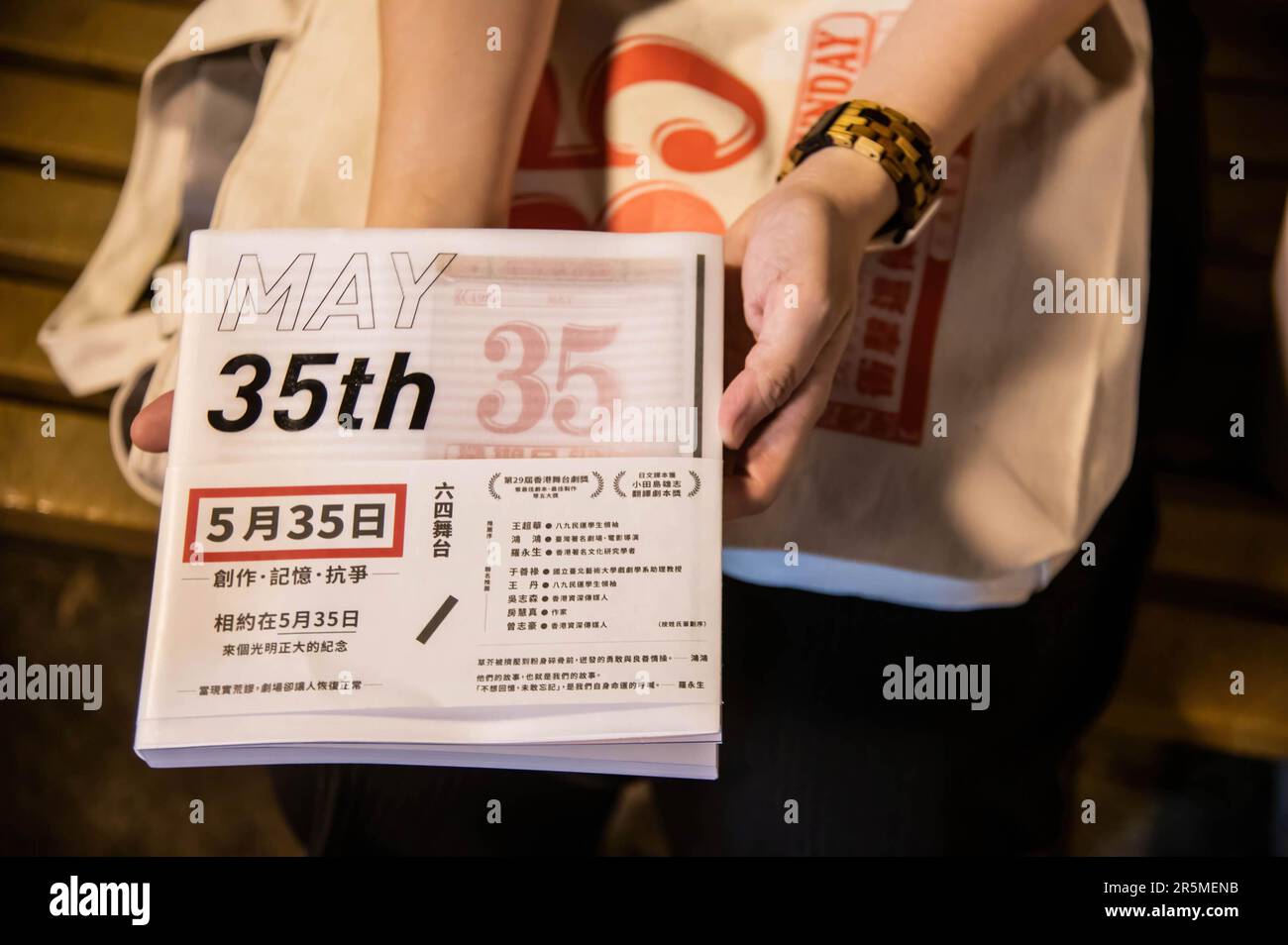Hong Kong, China. 04th June, 2023. A woman reads "May 35th" on a bench ...