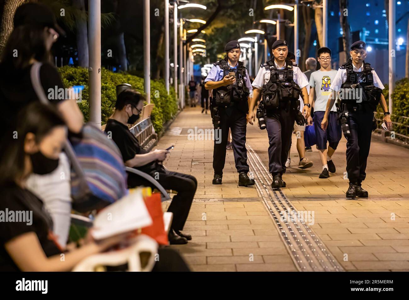 Hong Kong, China. 04th June, 2023. A woman reads "May 35th" on a bench ...
