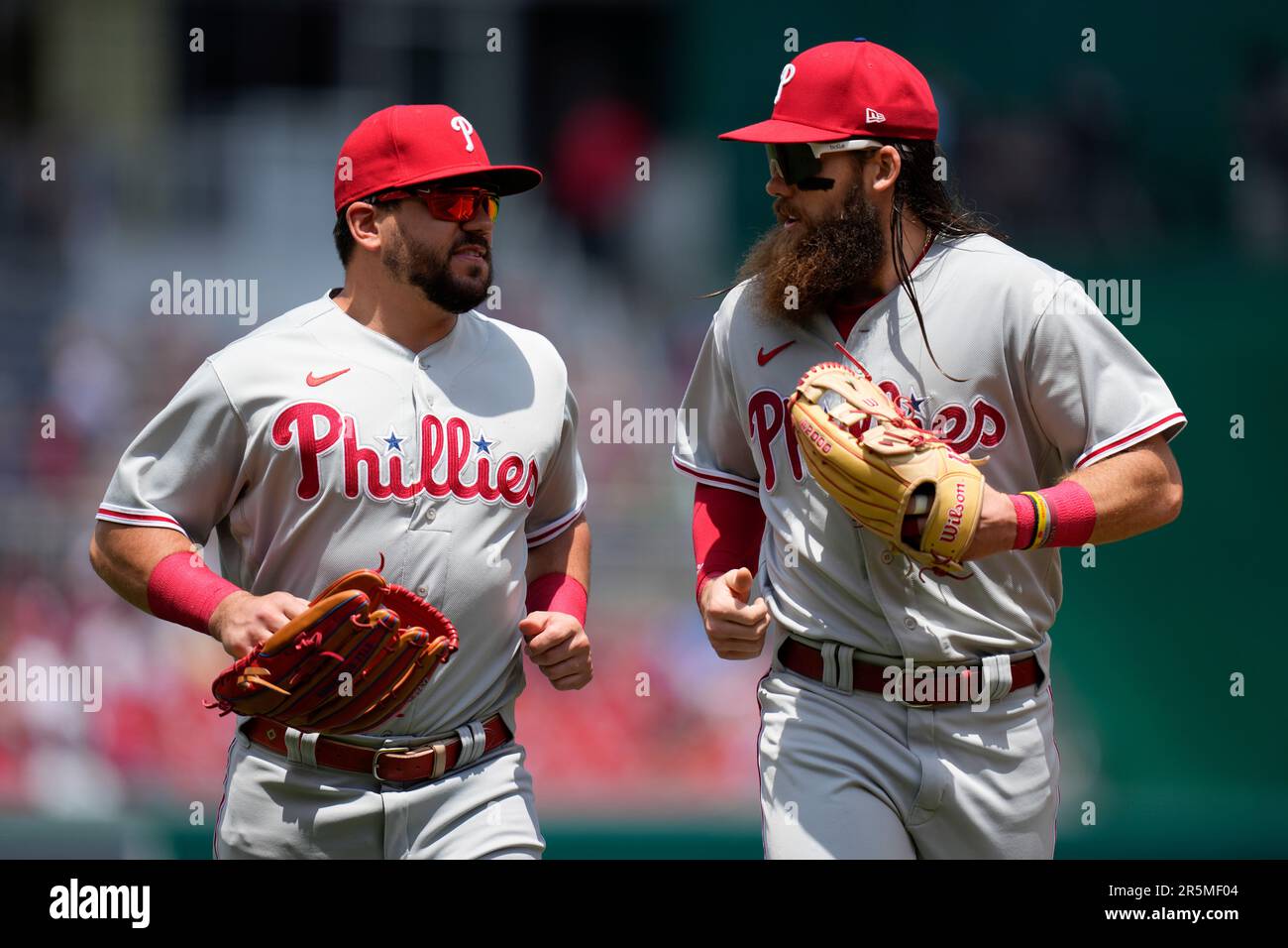 Philadelphia Phillies left fielder Kyle Schwarber, left, and center ...