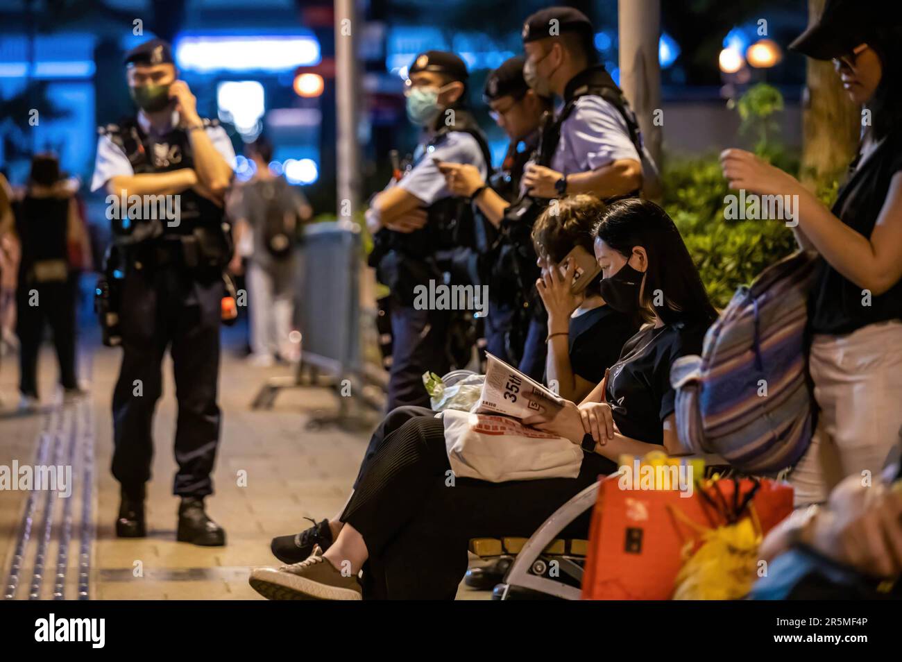 Hong Kong, China. 04th June, 2023. A woman reads "May 35th" on a bench ...
