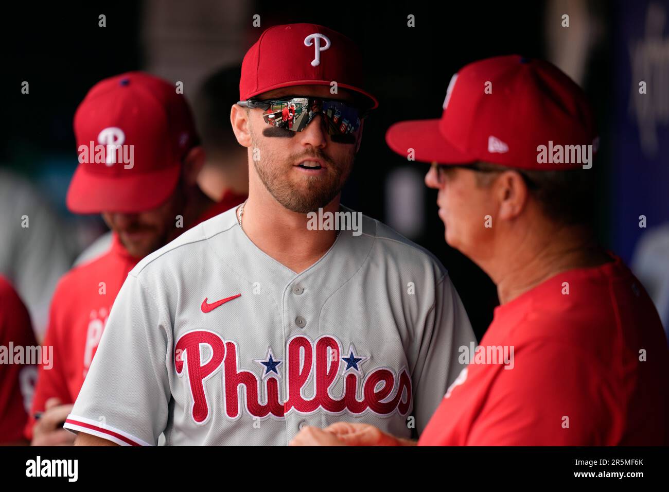 Philadelphia Phillies' Kody Clemens, center, chats in the dugout before ...