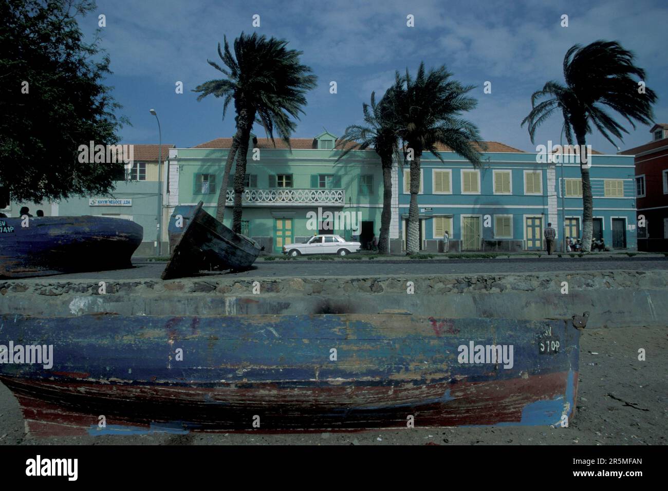 a fishing Boat at the fish market with colonial Houses in the City ...