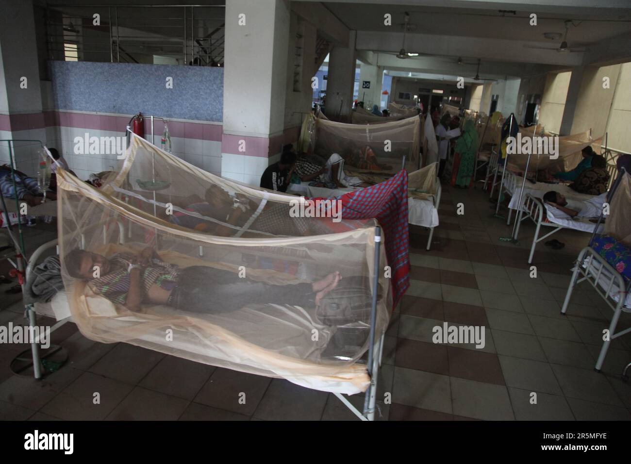 Dengue fever patients lying on the floor and on the bed outside the ...