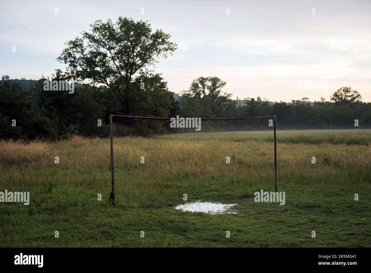 Simple small soccer court in a rural area of Italy. Goal made with ...