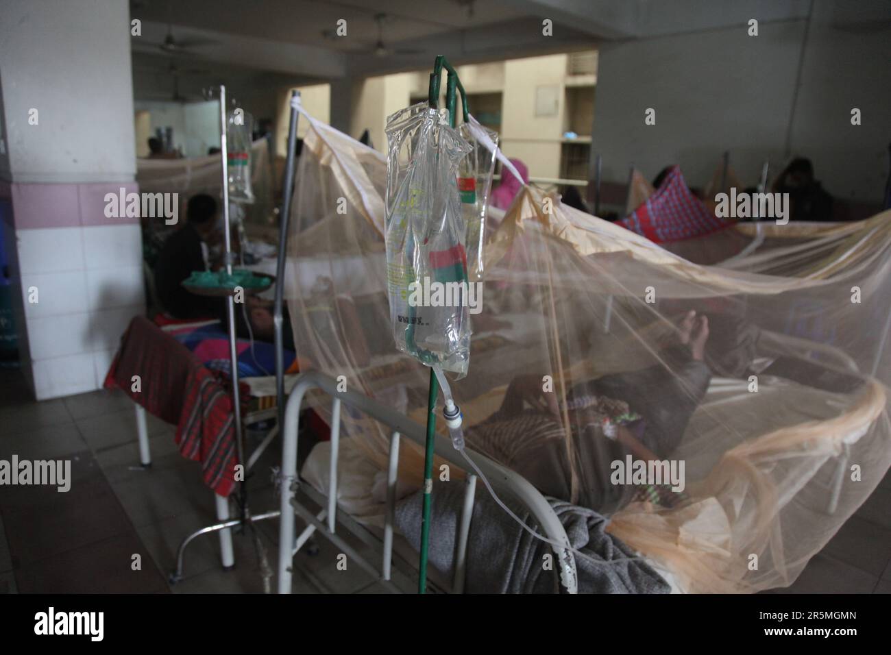 Dengue fever patients lying on the floor and on the bed outside the ...