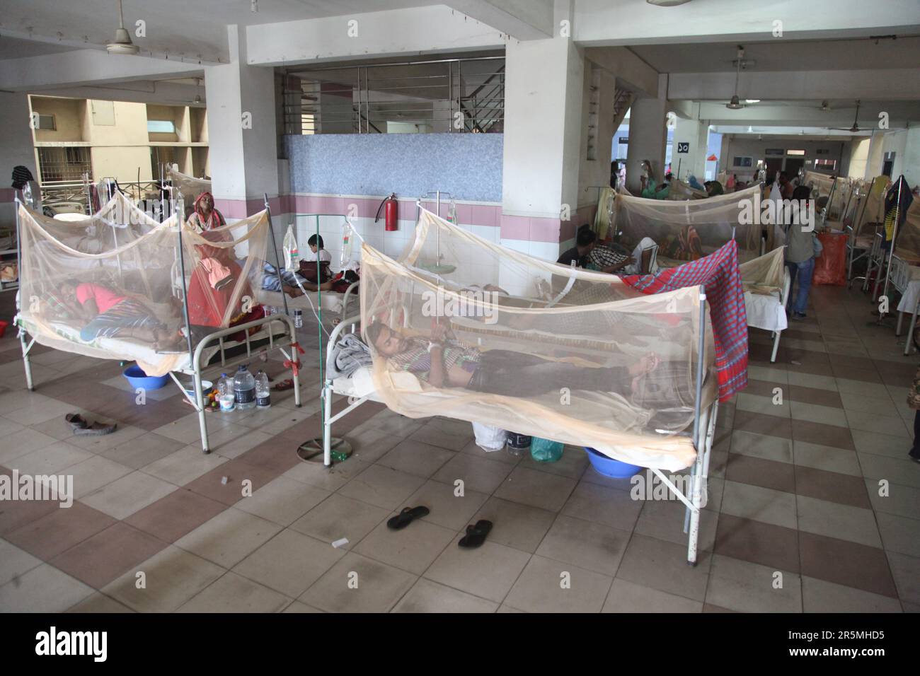 Dengue fever patients lying on the floor and on the bed outside the ...