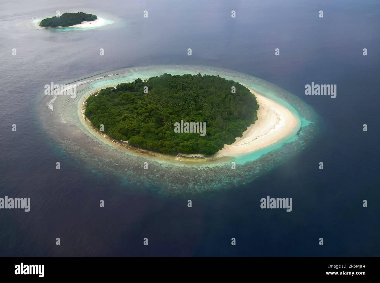Tropical Island in the ocean, Maldives. Aerial top view photo of small ...