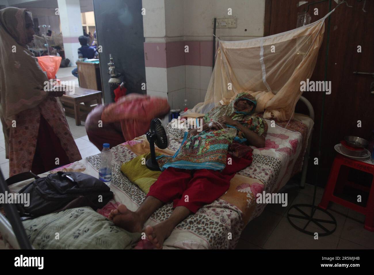 Dengue fever patients lying on the floor and on the bed outside the ...