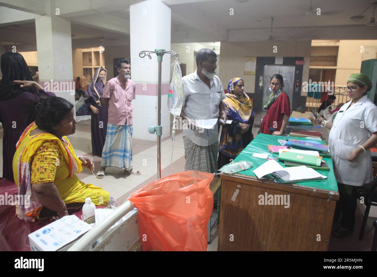 Dengue fever patients lying on the floor and on the bed outside the ...