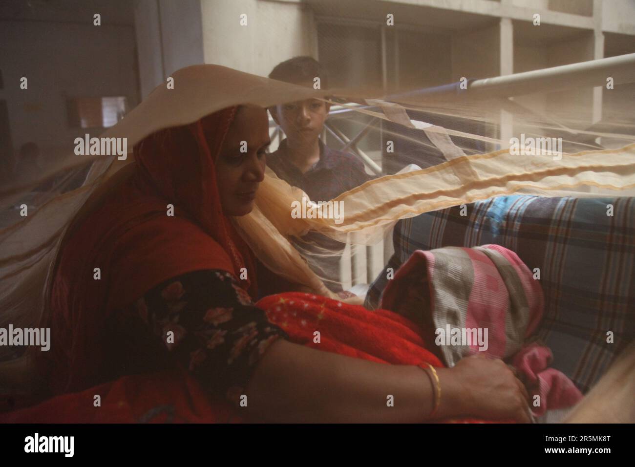 Dengue fever patients lying on the floor and on the bed outside the mugda medical hospital ...