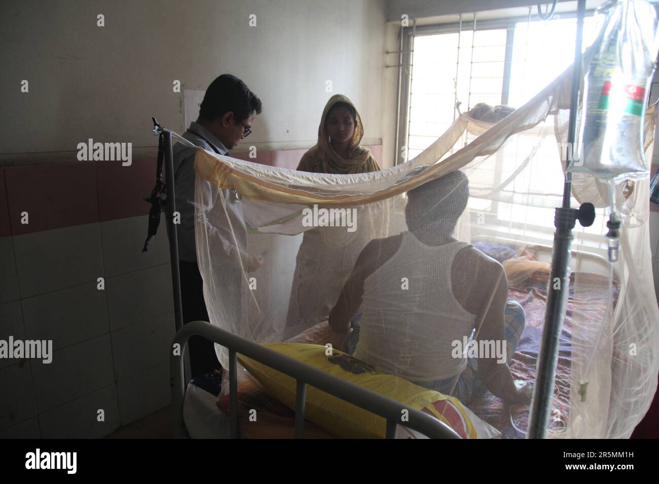 Dengue fever patients lying on the floor and on the bed outside the ...