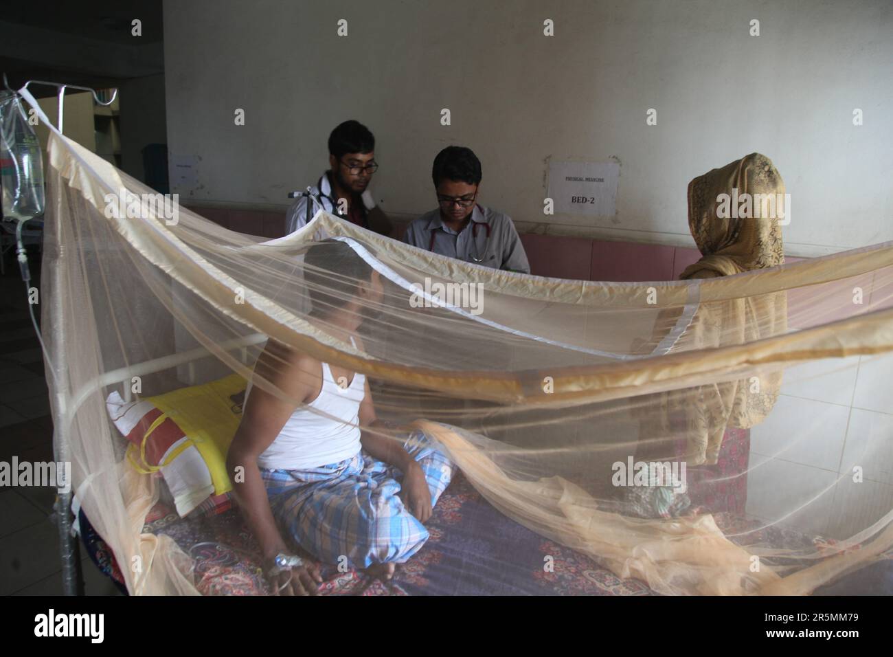 Dengue fever patients lying on the floor and on the bed outside the ...