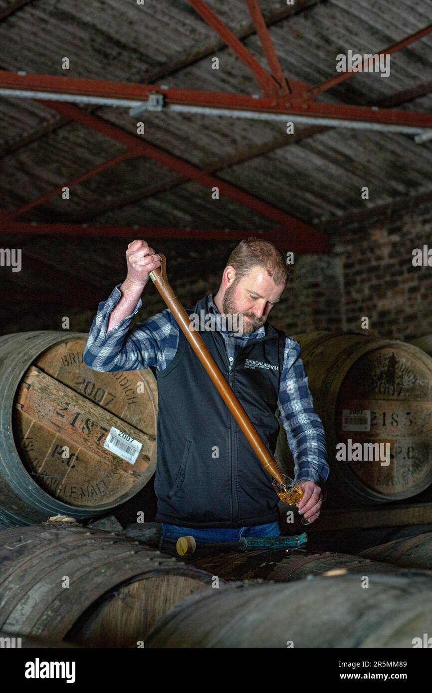 Head distiller Adam Hannett is sampling whisky at the Bruichladdich ...