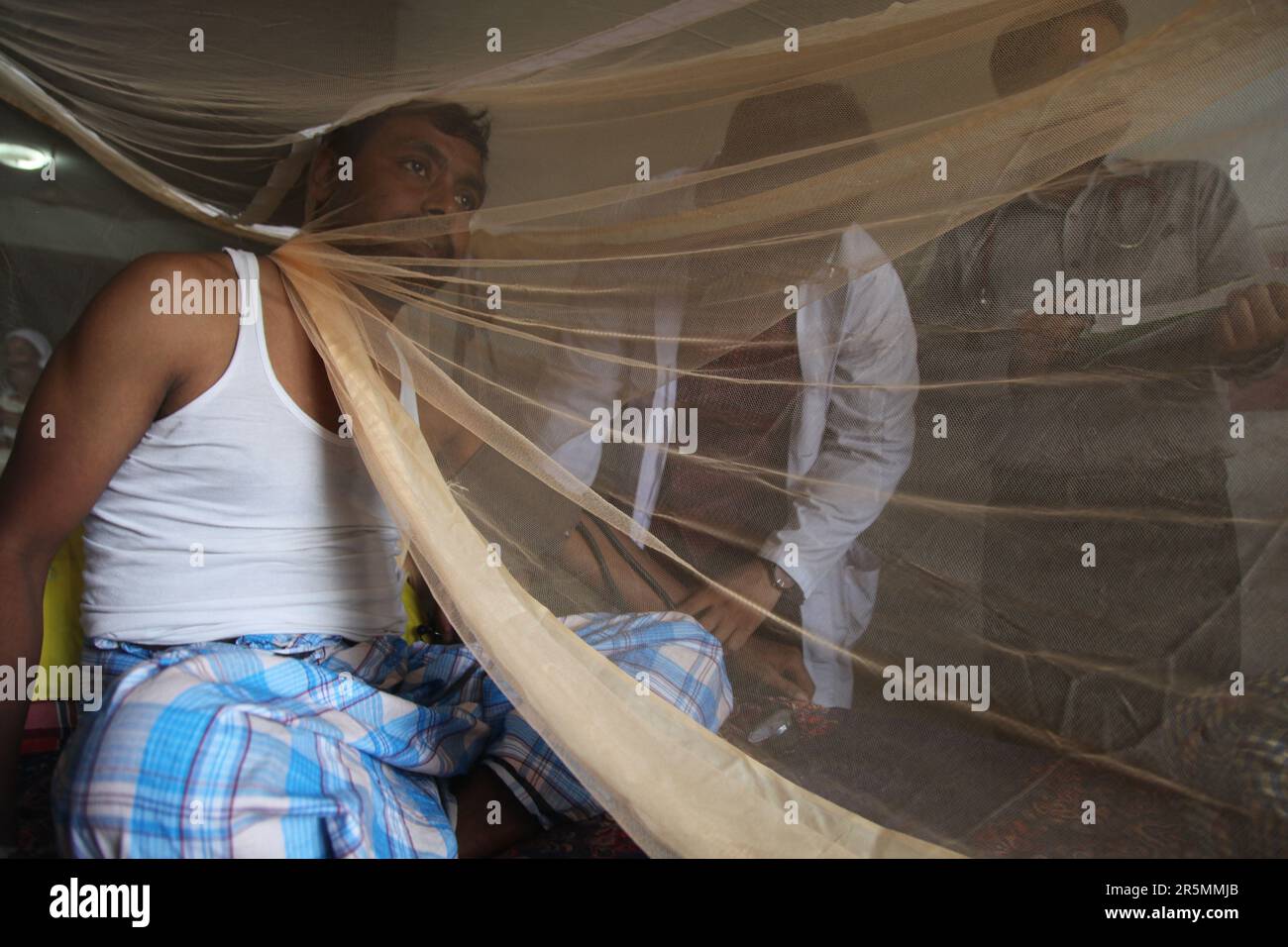 Dengue fever patients lying on the floor and on the bed outside the mugda medical hospital ...