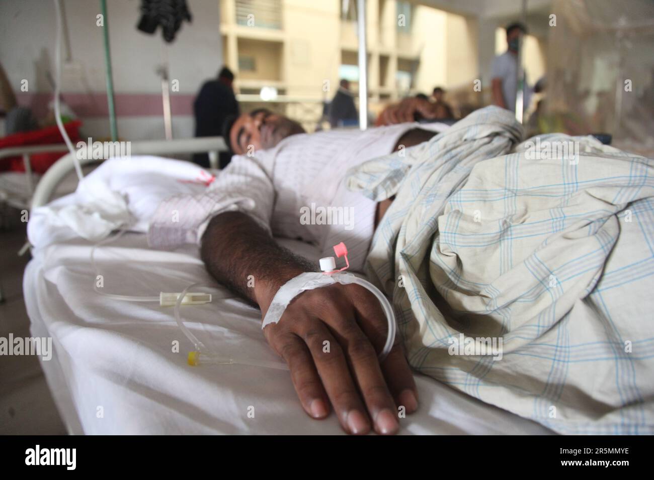 Dengue fever patients lying on the floor and on the bed outside the ...