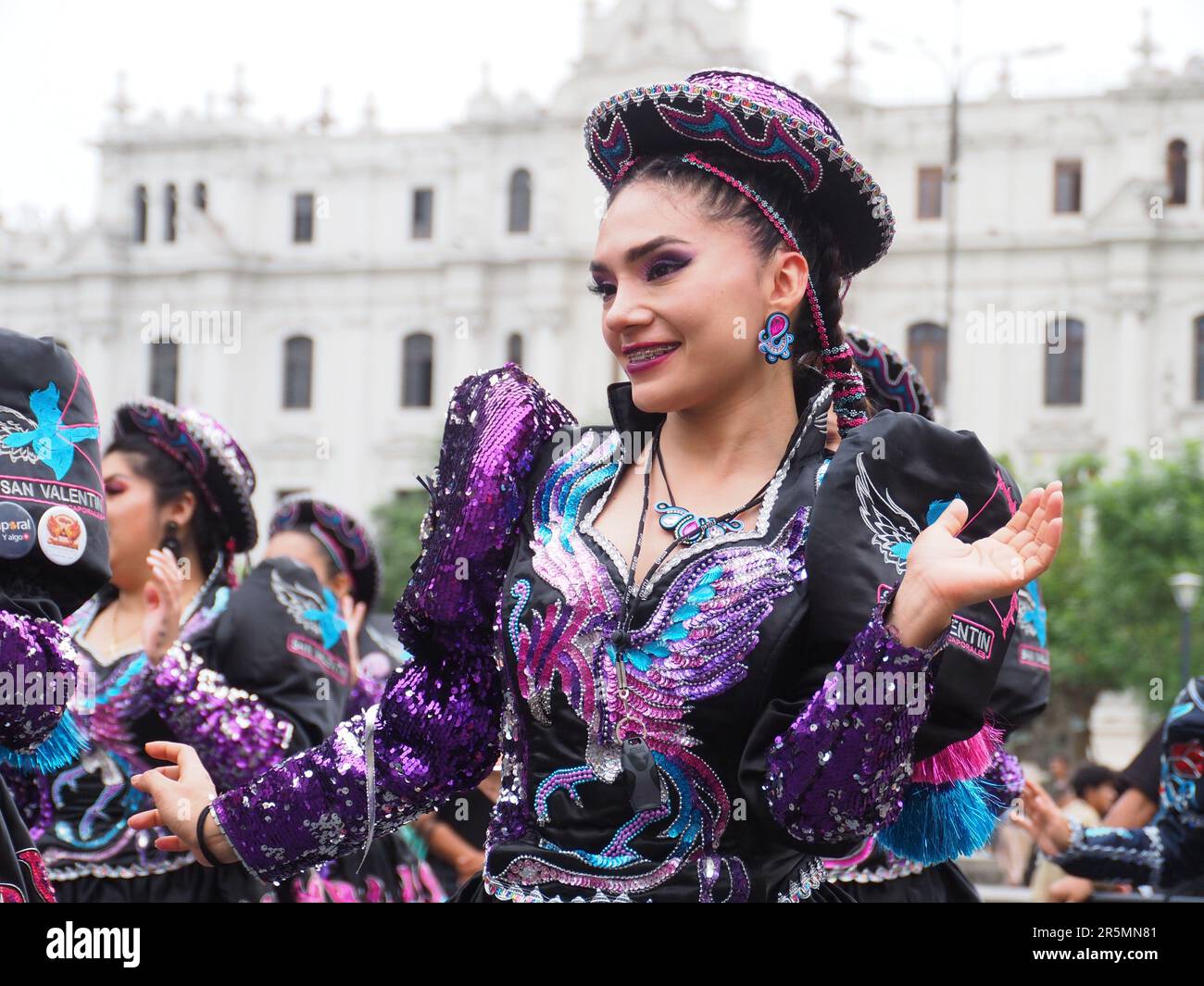 Troupe of women performing a dance, and wearing traditional costumes ...