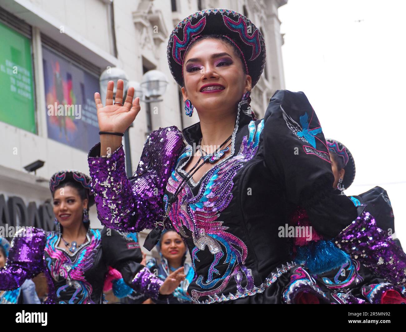 Troupe of women performing a dance, and wearing traditional costumes ...