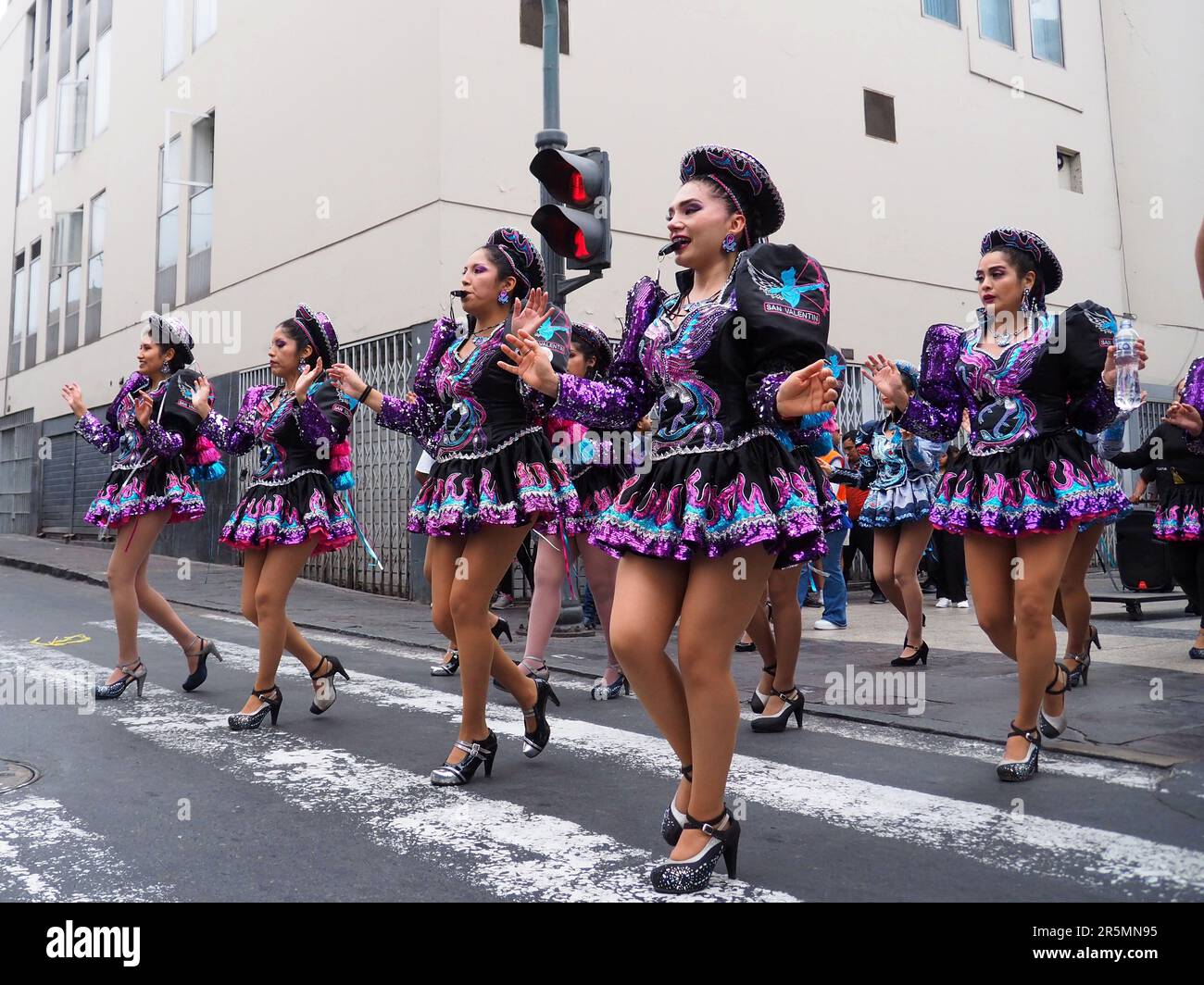 Troupe of women performing a dance, and wearing traditional costumes ...