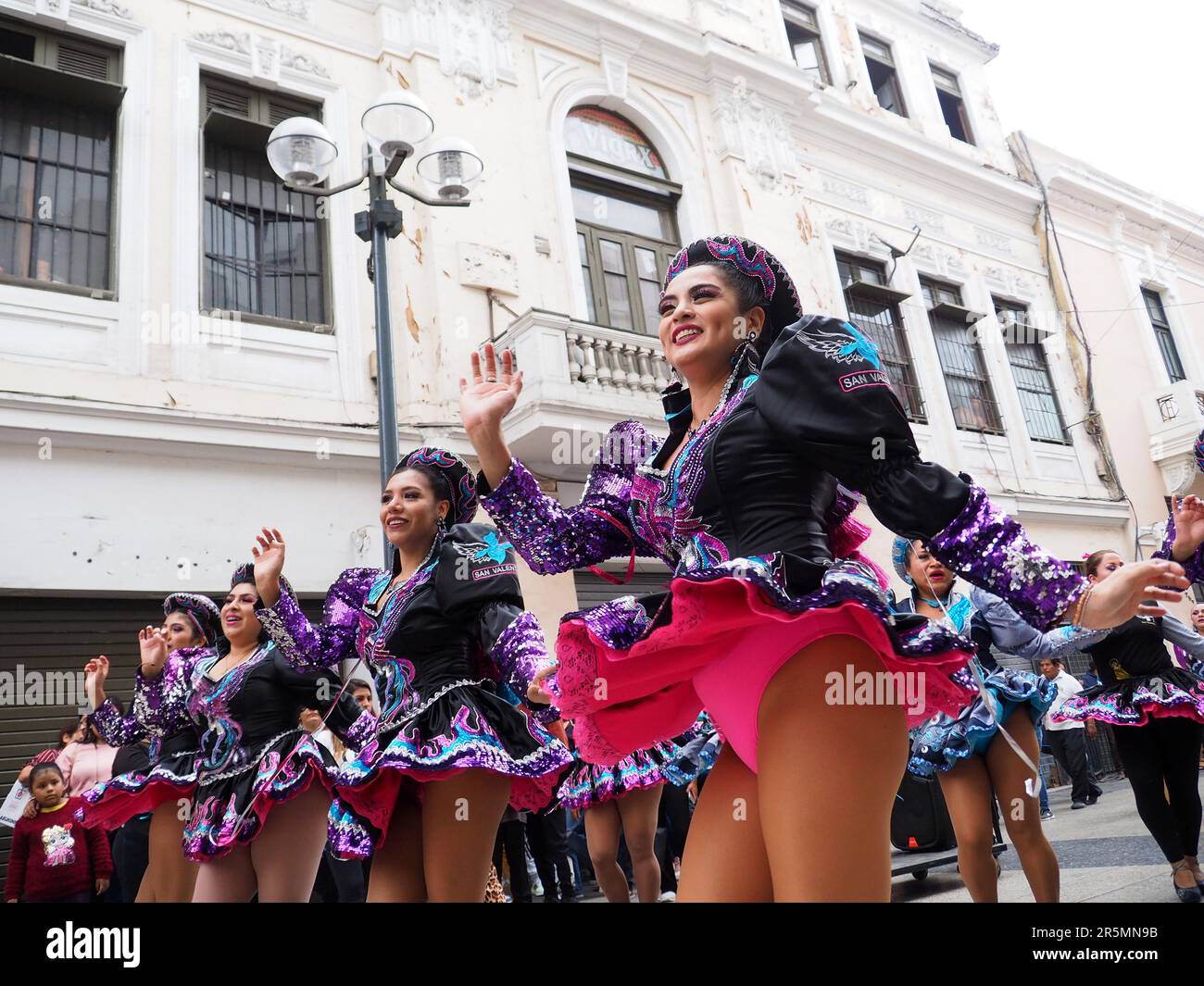 Troupe of women performing a dance, and wearing traditional costumes ...