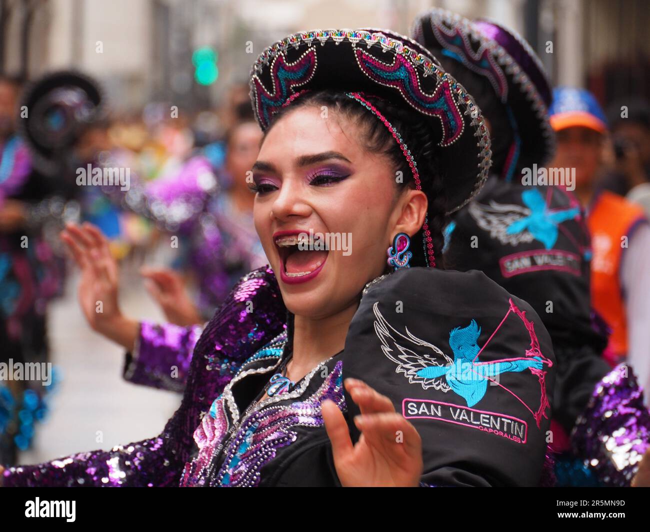 Troupe of women performing a dance, and wearing traditional costumes ...